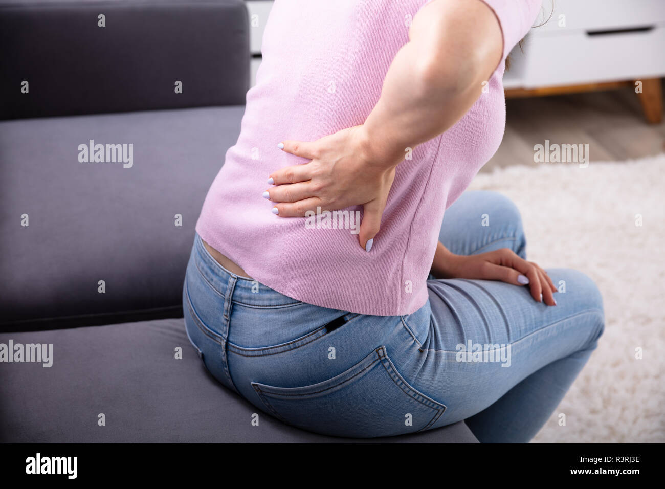 Back pain woman close up hi-res stock photography and images - Alamy