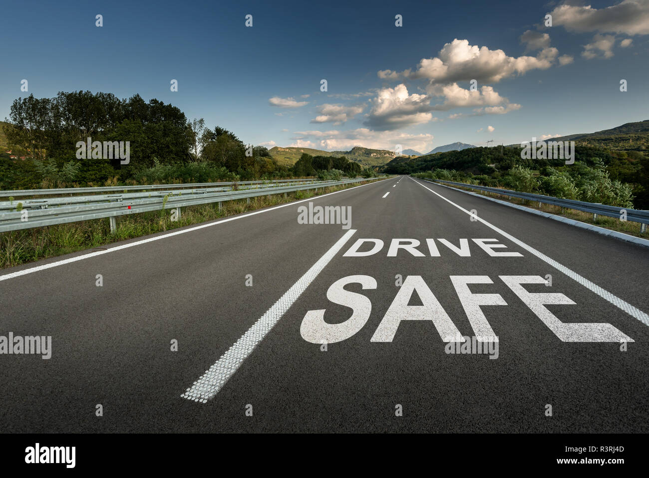 Drive safe message on Asphalt highway road through the countryside to ...