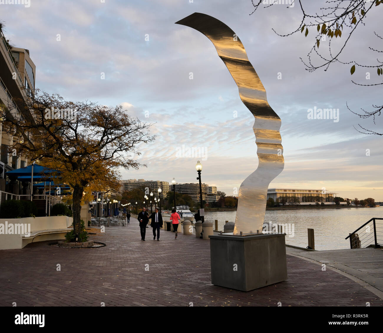 Georgetown Waterfront Park pedestrian walkway along Potomoac River with ...