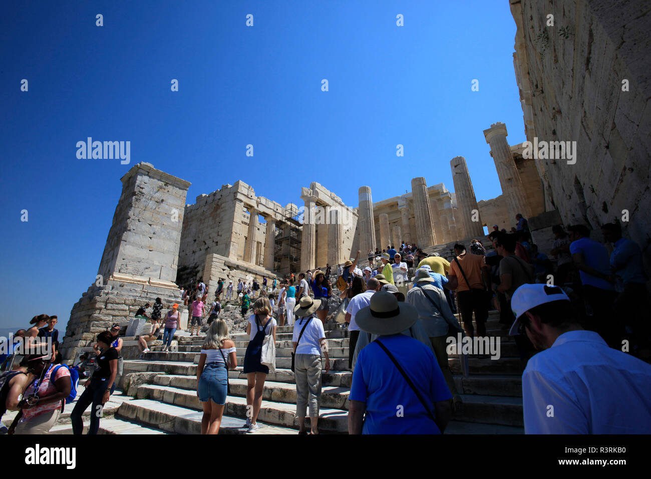 Tourist climb steep steps to enter the Parthenon in Athens, Greece ...
