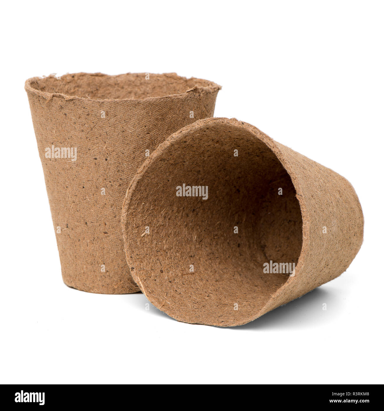 Two paper recycle pots on white background Stock Photo - Alamy
