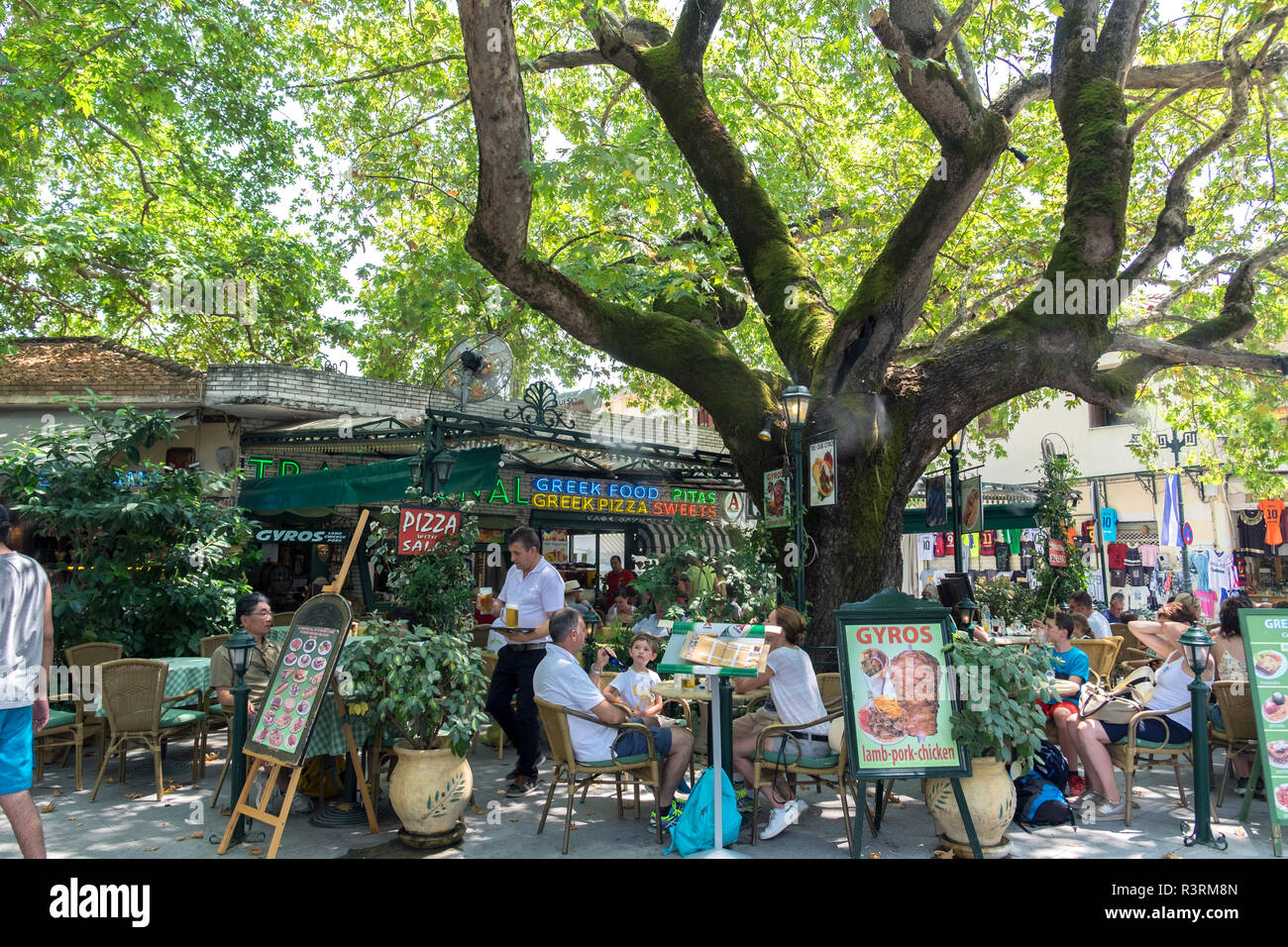 Open-air Greek restaurant, Olympia, Greece Stock Photo - Alamy
