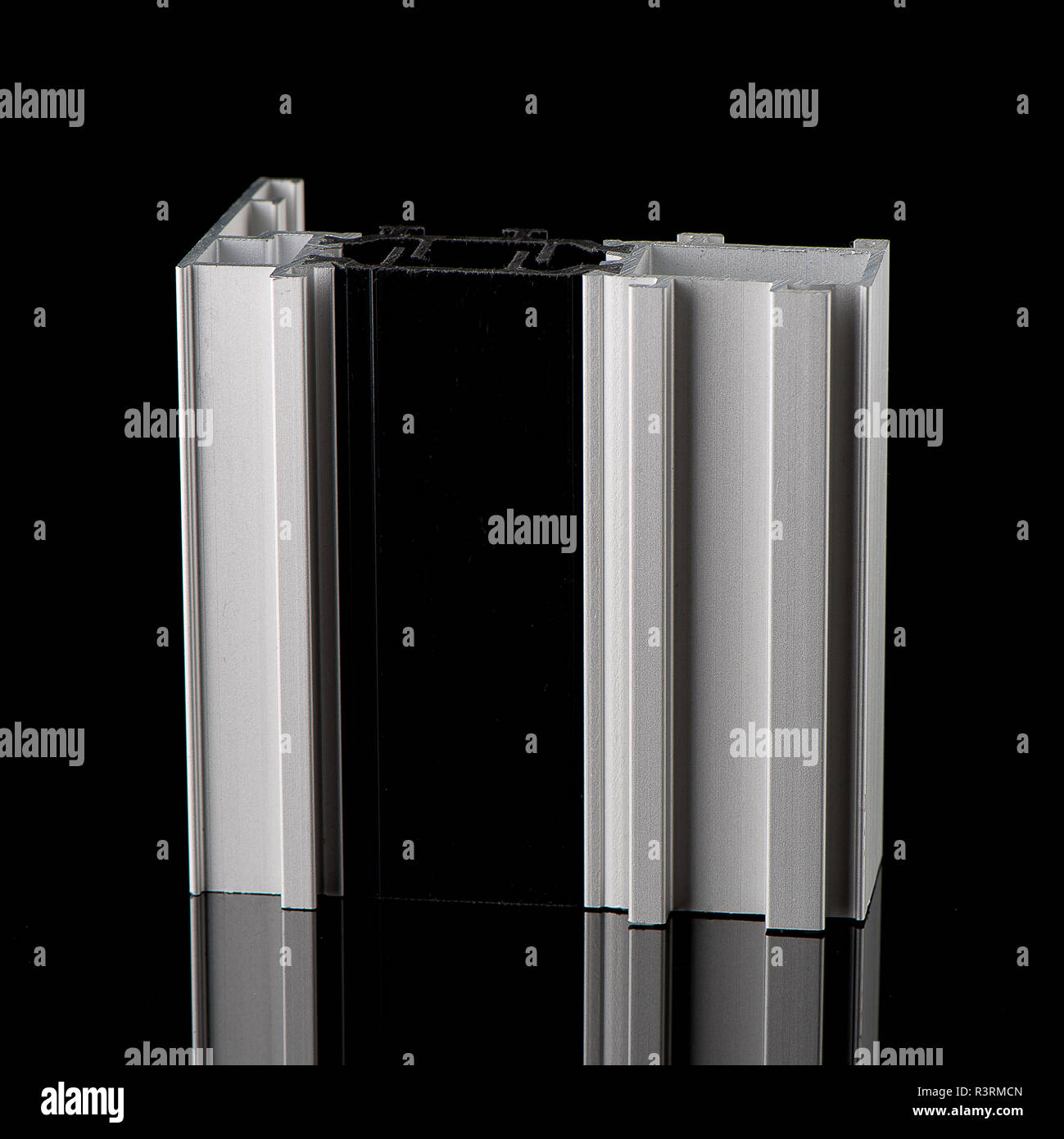 Aluminium profile sample isolated on black background Stock Photo - Alamy
