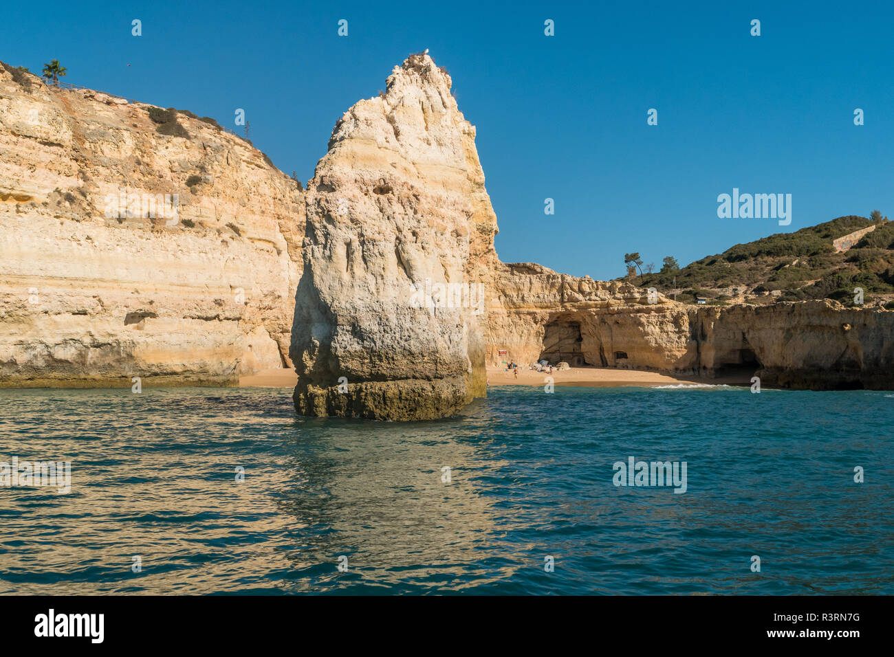 Beautiful Praia do Carvalho beach with golden rock cliffs, Portugal ...