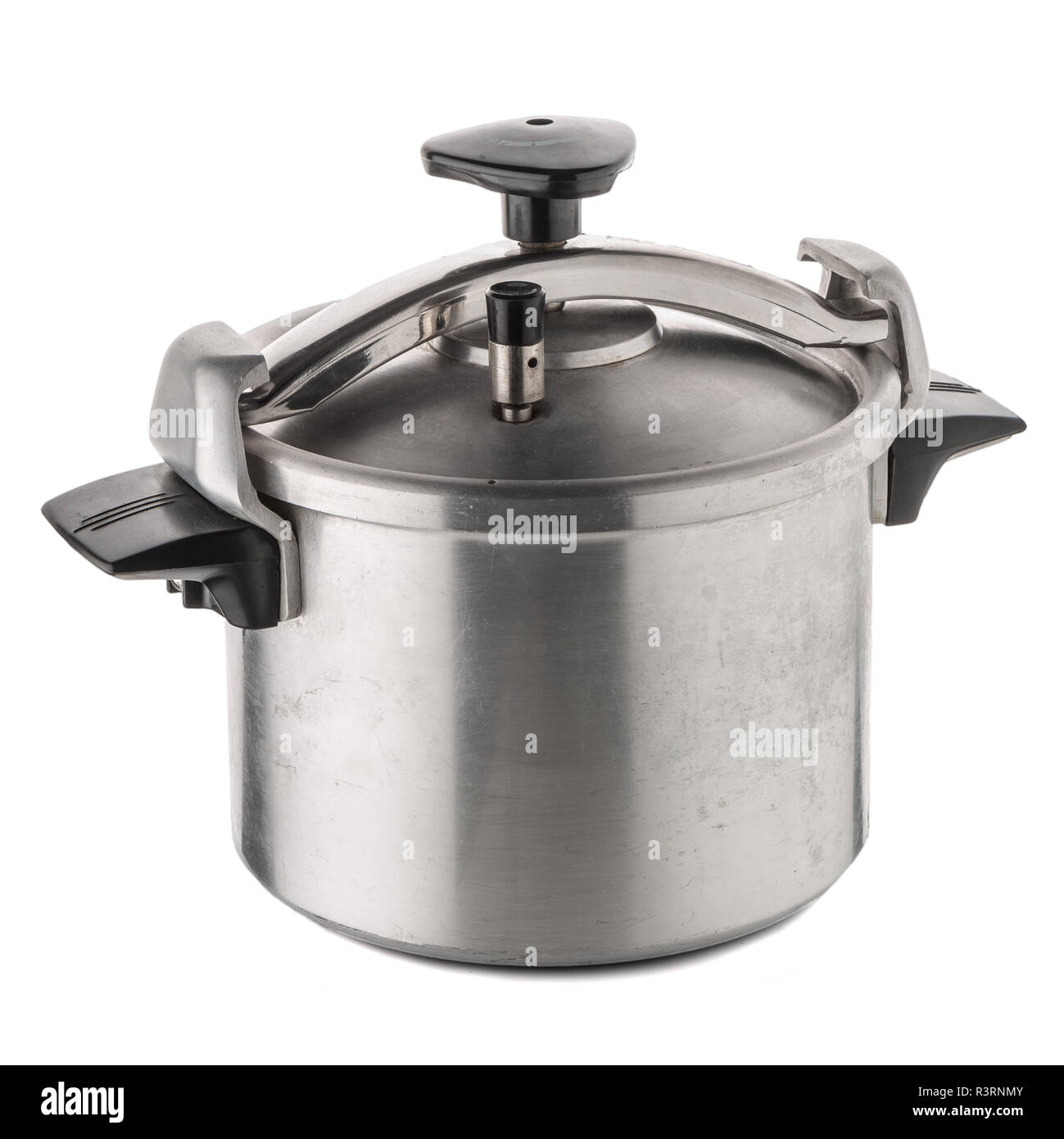 Used pressure cooker for cooking over white background Stock Photo - Alamy