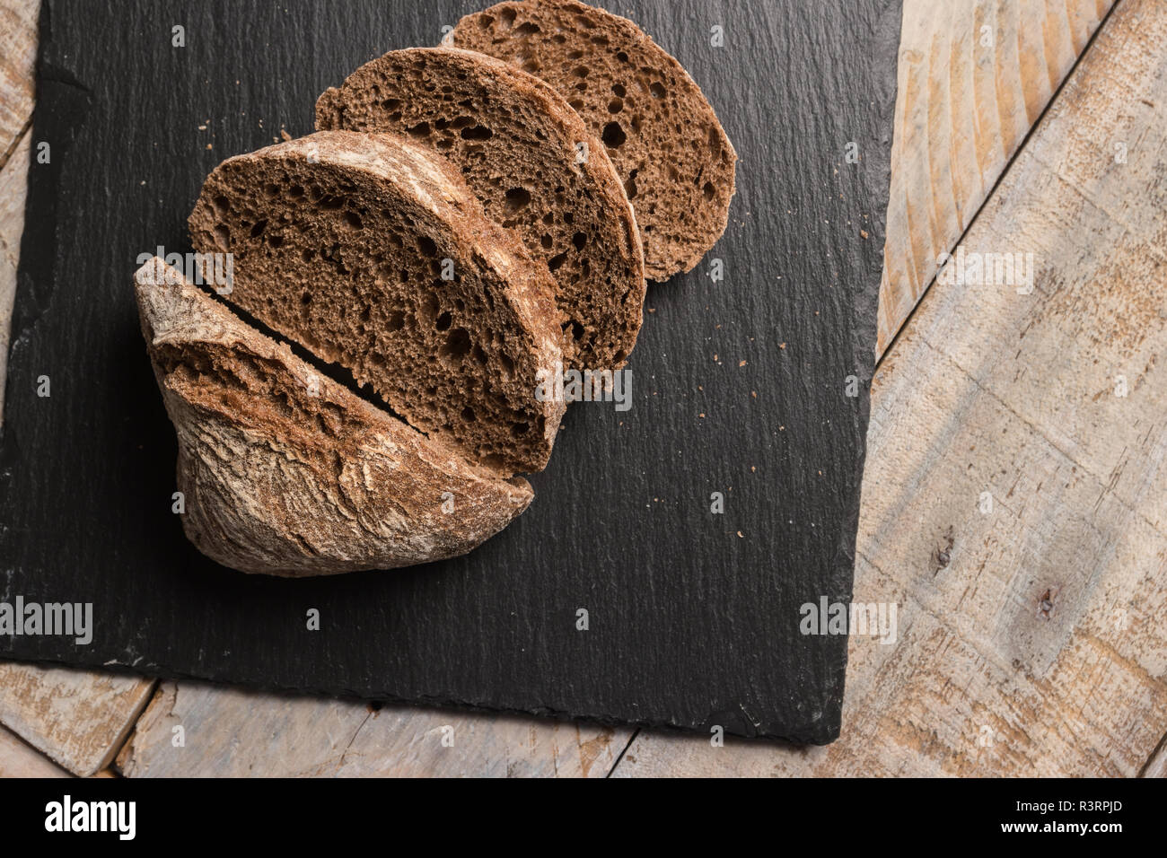Malt loaf bread slices on table Stock Photo - Alamy