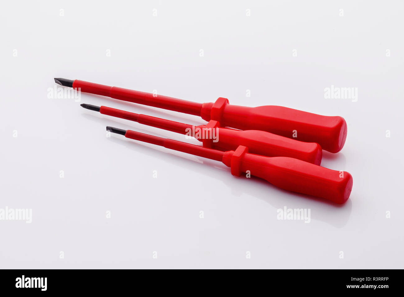 Screws and screwdriver isolated on white background. Long nasal and ...