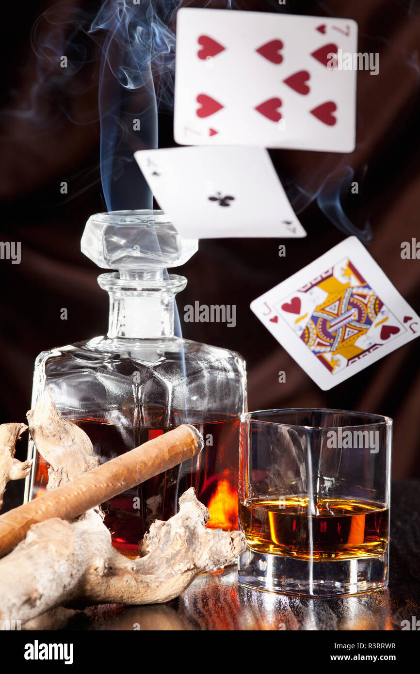 alcohol consumption,gambling and cigar smoke Stock Photo - Alamy