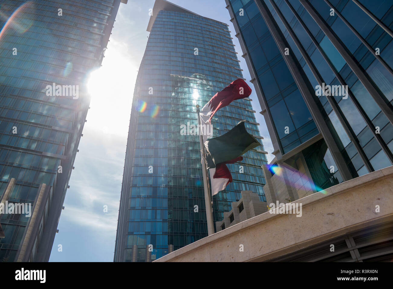 Qatar Flags Sailing Surrounded with Modern Blue High Skyscrapers in ...