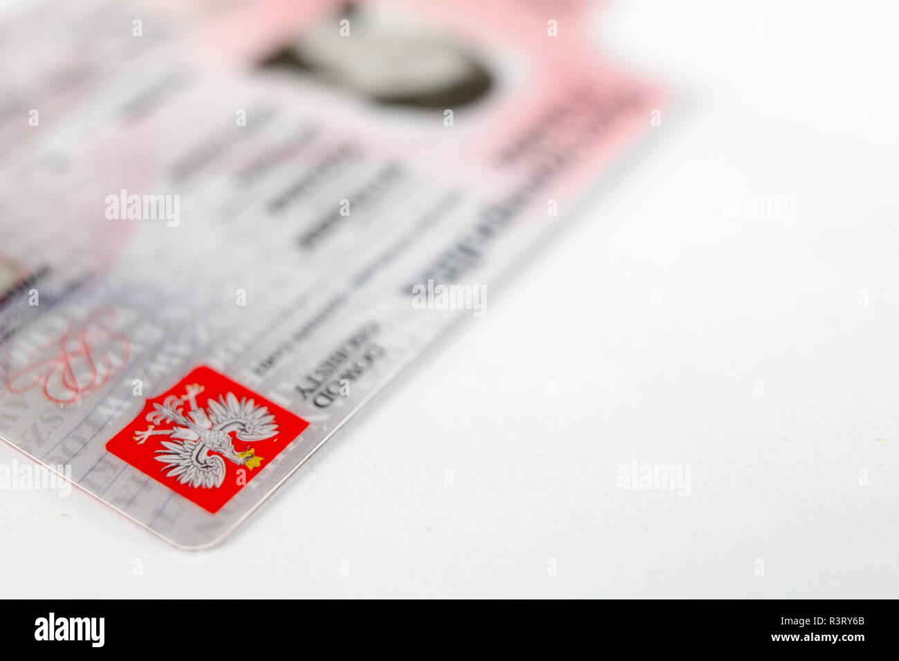 Polish ID card on a white table. An identification document with Polish ...