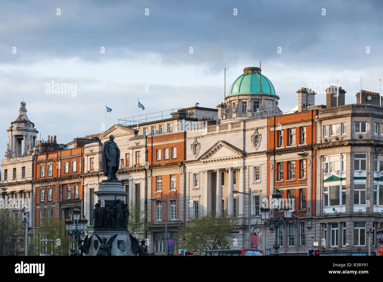 Ireland, Dublin, O'Connell Street buildings and statue of Daniel O ...