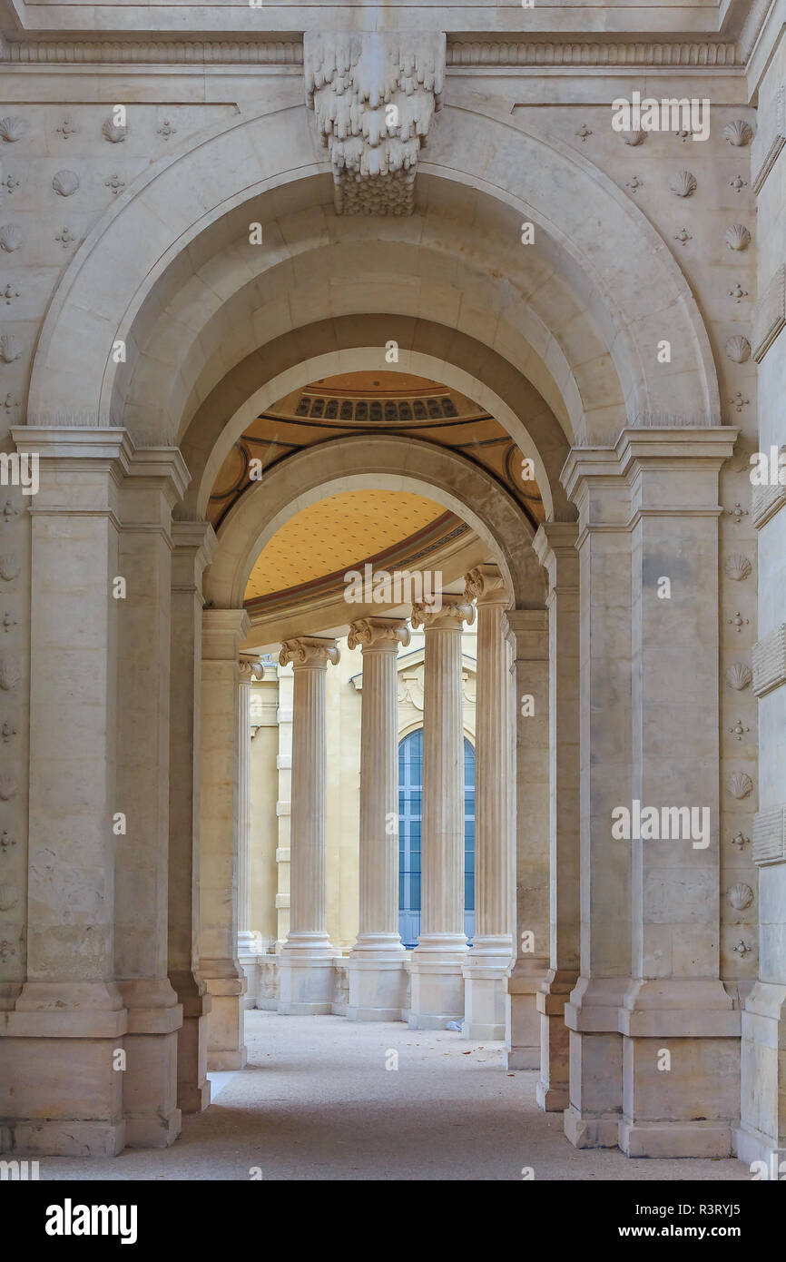 Classic archway with a perspective view onto the Roman style colonnade ...