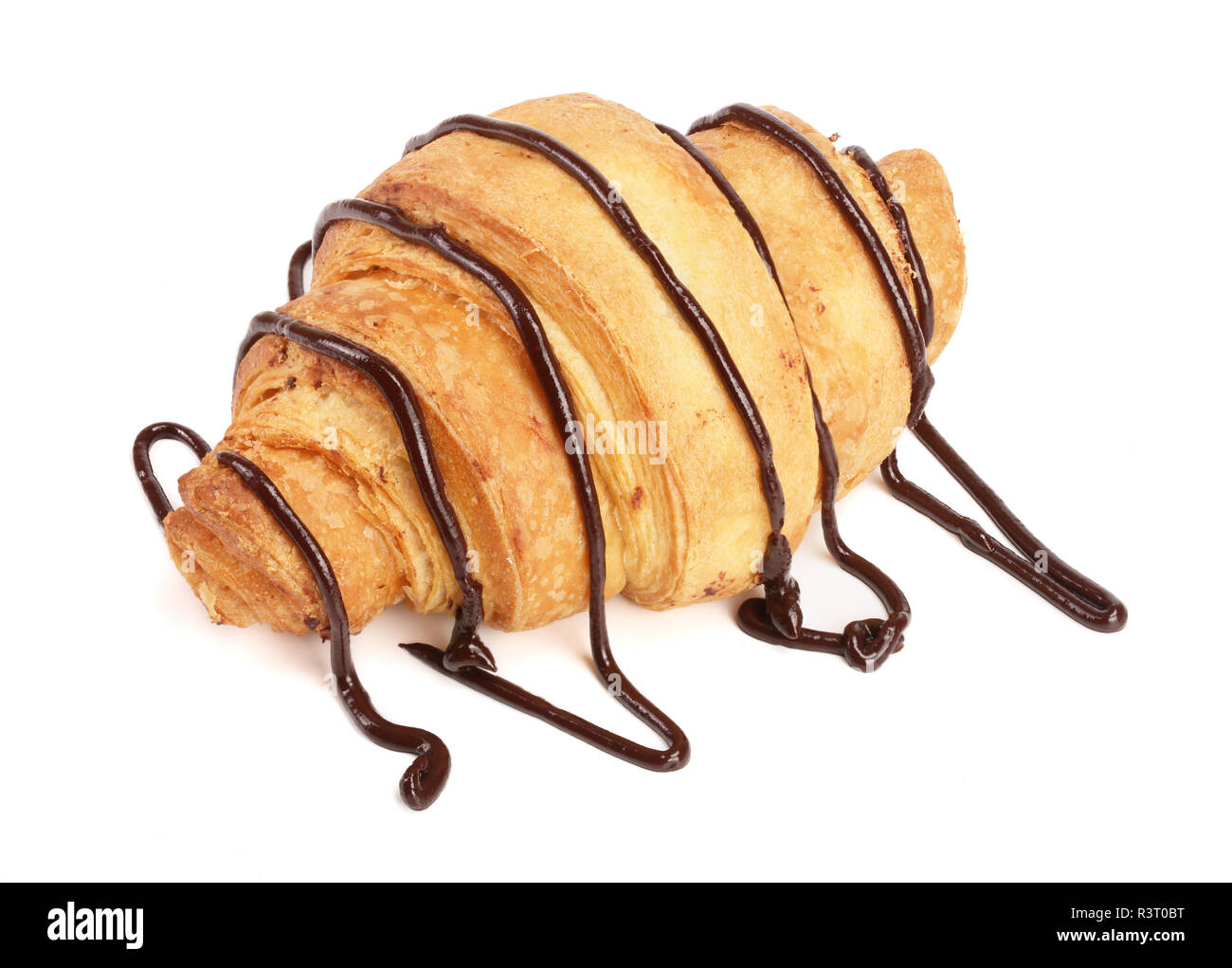 croissant decorated with chocolate sauce isolated on white background ...