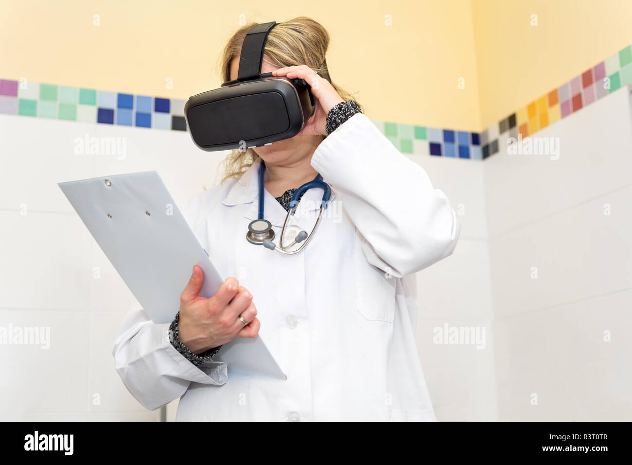 Female doctor wearing virtual reality glasses. Medical technology ...