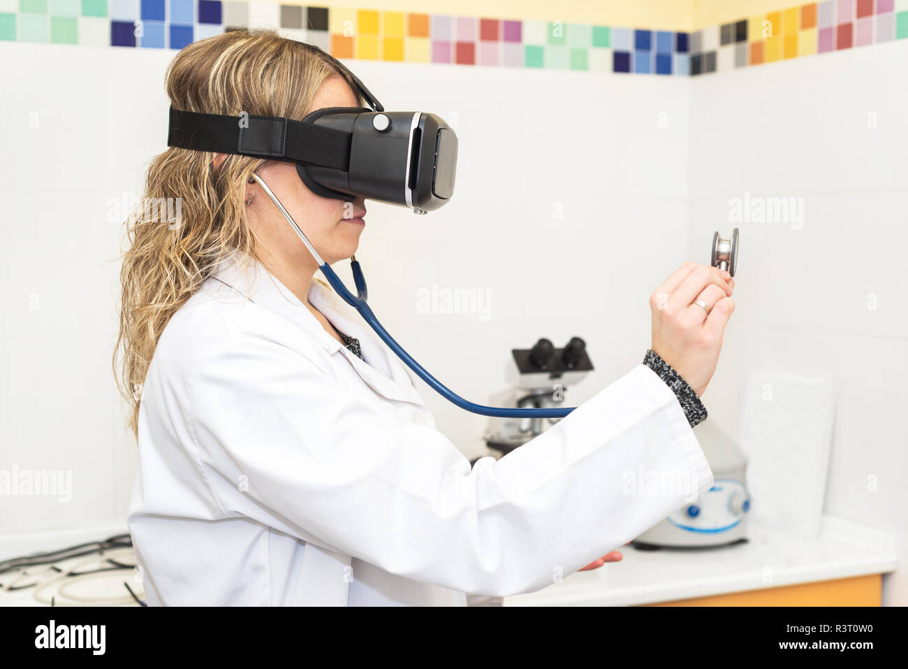 Female doctor wearing virtual reality glasses. Medical technology ...
