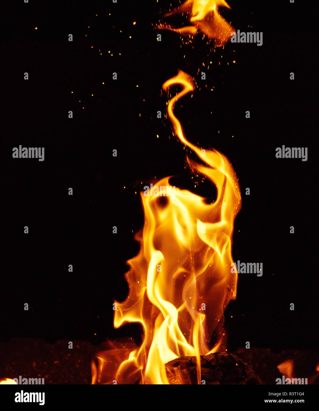 bright orange and yellow flames with sparks, close up Stock Photo - Alamy