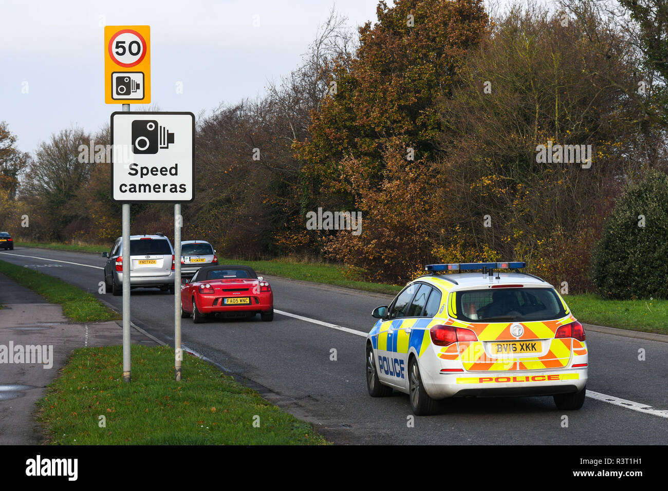 police car passes a speed camera sign Stock Photo - Alamy