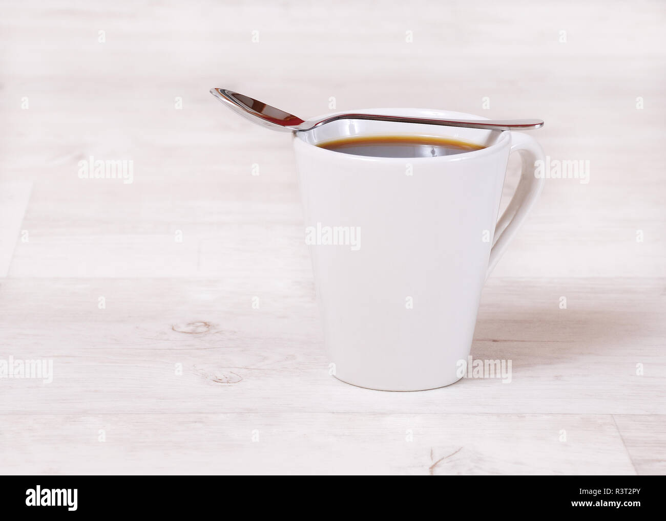coffee cup with spoon Stock Photo - Alamy