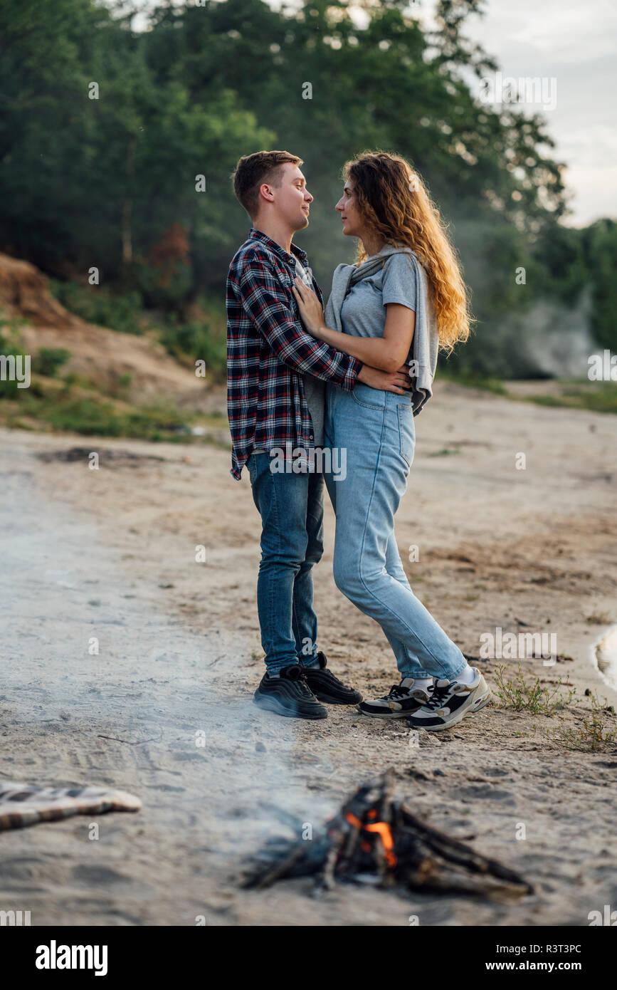 Romantic couple at the riverside, falling in love Stock Photo - Alamy