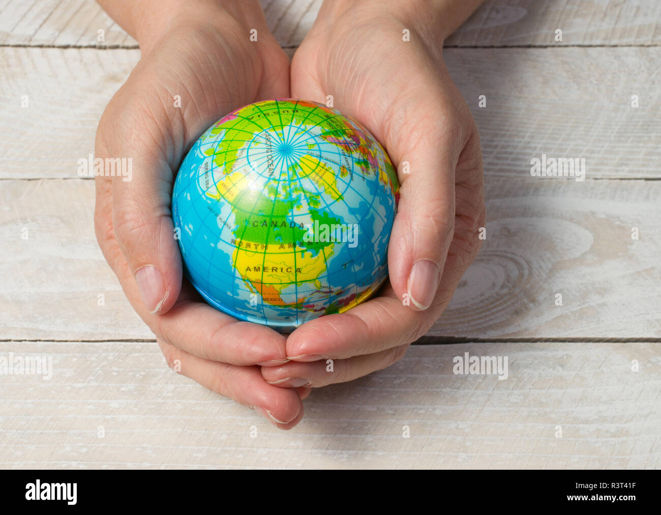 the earth with hands Stock Photo - Alamy