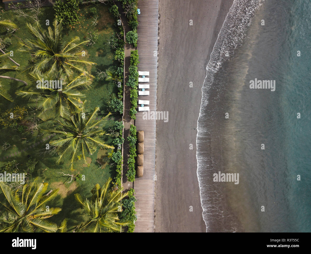 Indonesia, Bali, Aerial view of beach with empty sun loungers Stock ...