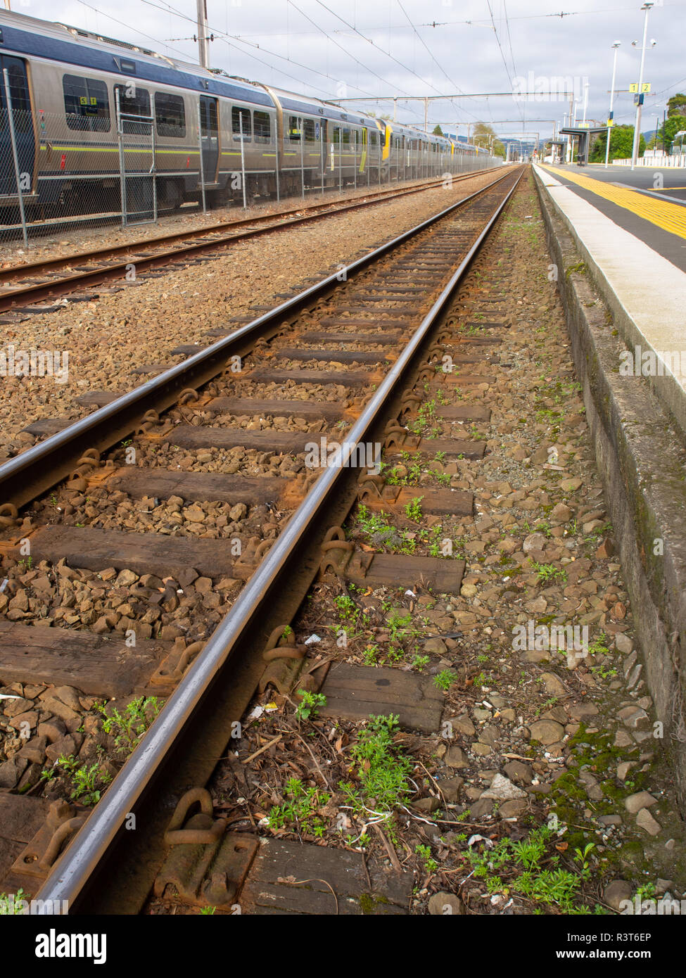 Railway Lines By The Train Station Platform Stock Photo - Alamy