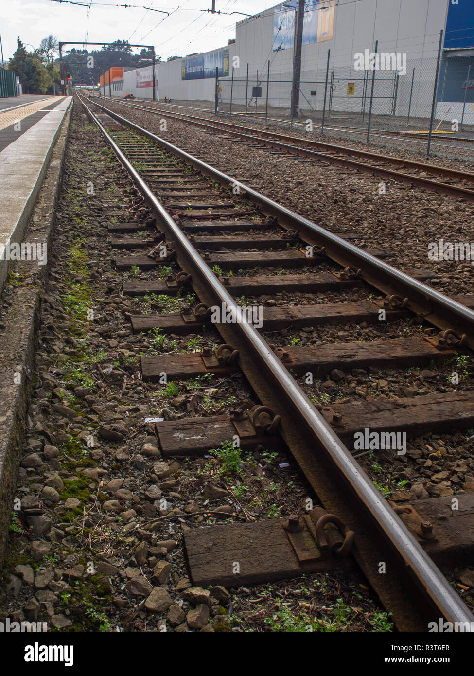 Railway Lines By The Train Station Platform Stock Photo - Alamy
