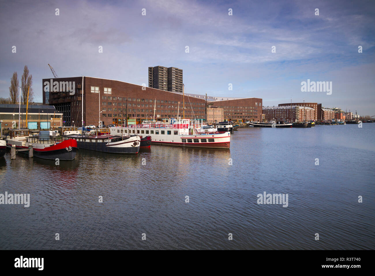 Netherlands, Amsterdam. Eastern Docklands, Spoorweg-basin and renovated ...