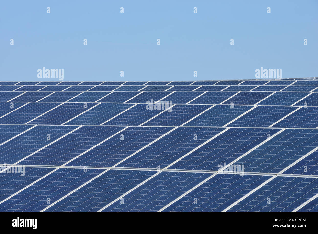 Germany, View of large number of solar panels at solar plant field ...