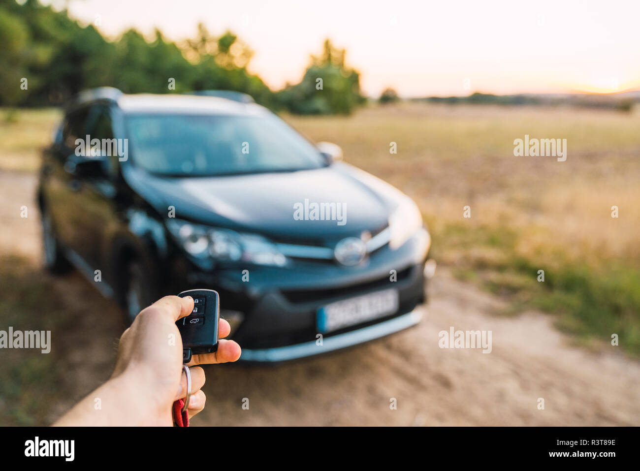 Man opening car with remote control key, close-up Stock Photo - Alamy