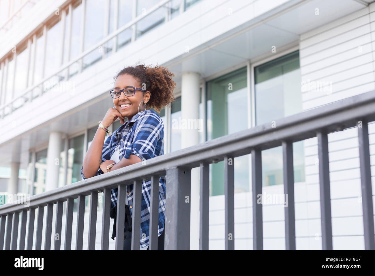 Person by railing hi-res stock photography and images - Alamy