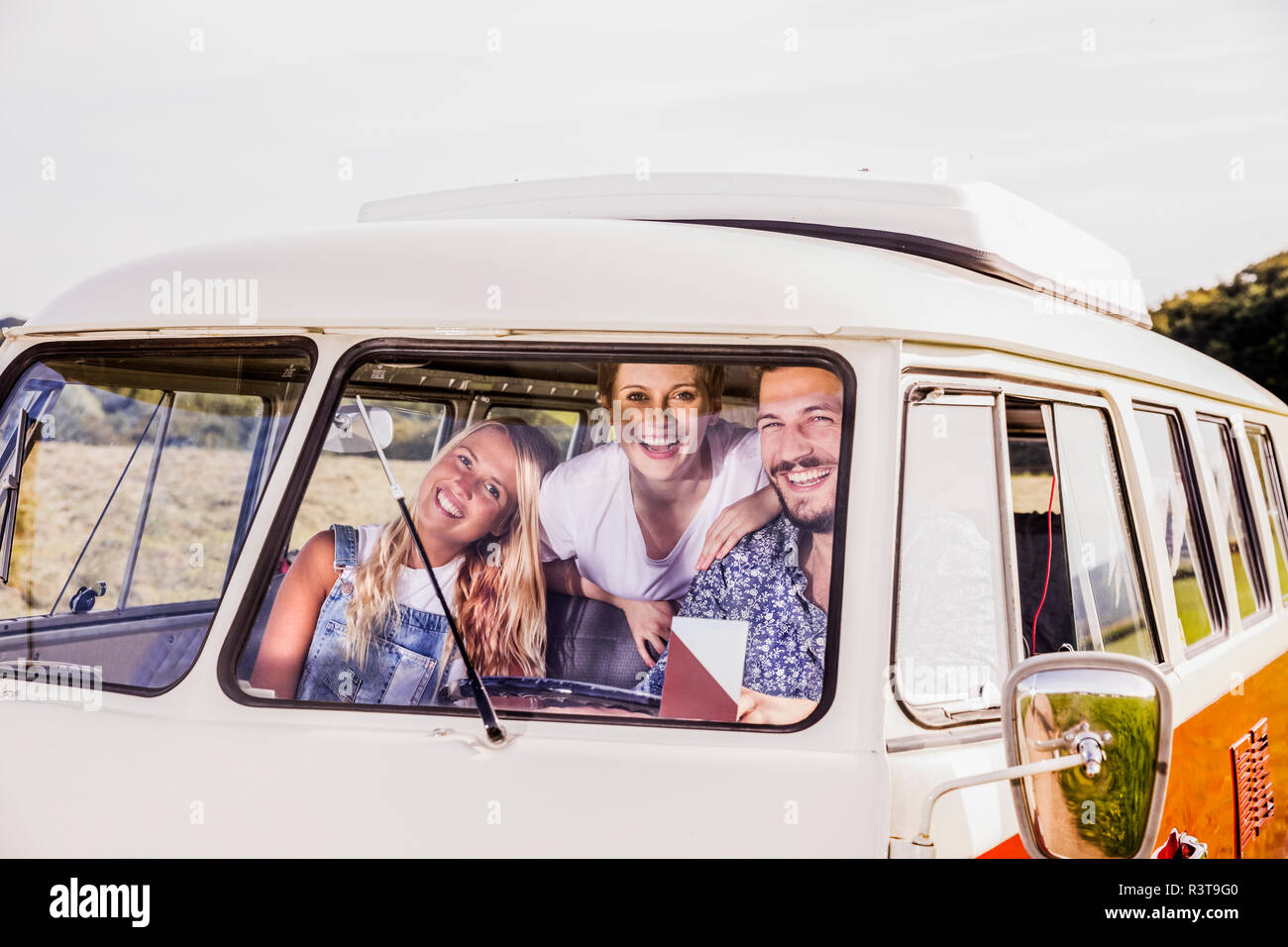 Happy friends inside van Stock Photo - Alamy