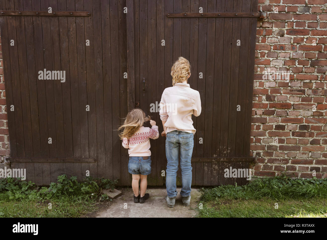Brother sister standing side side hi-res stock photography and images ...