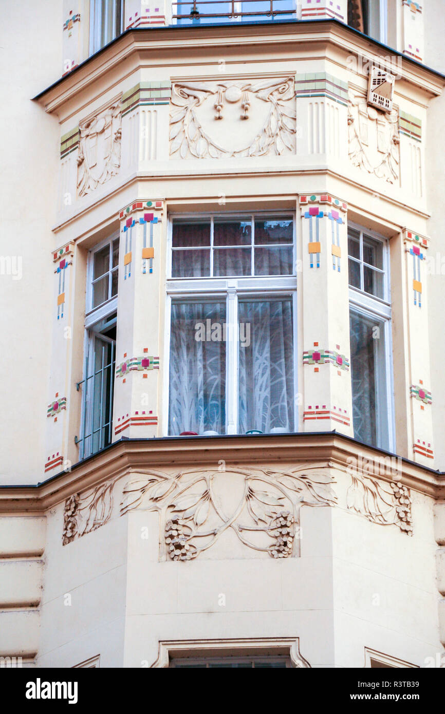 decorated bow-window on the baroque facade of an old palace in the old ...