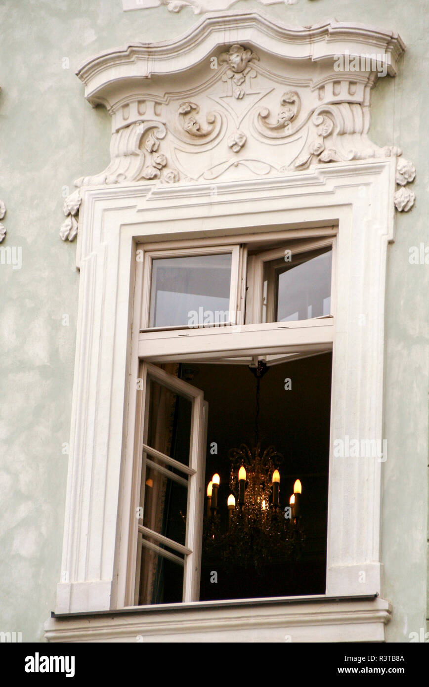 opened window on a decorated facade of building in Nerudova street of ...