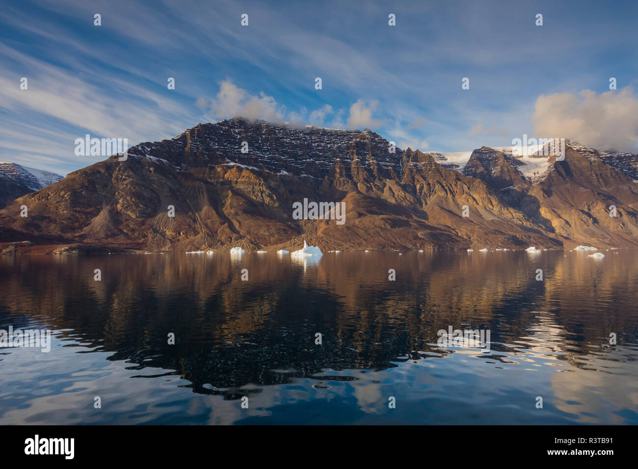 Greenland. Scoresby Sund. Milne Land. Small icebergs and rocky ...
