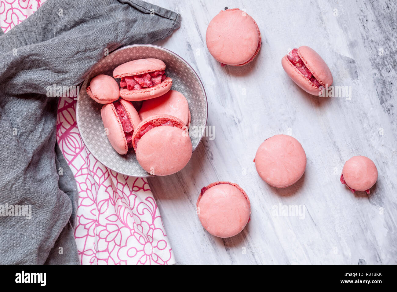 Pink macarons filled with raspberry buttercream Stock Photo - Alamy