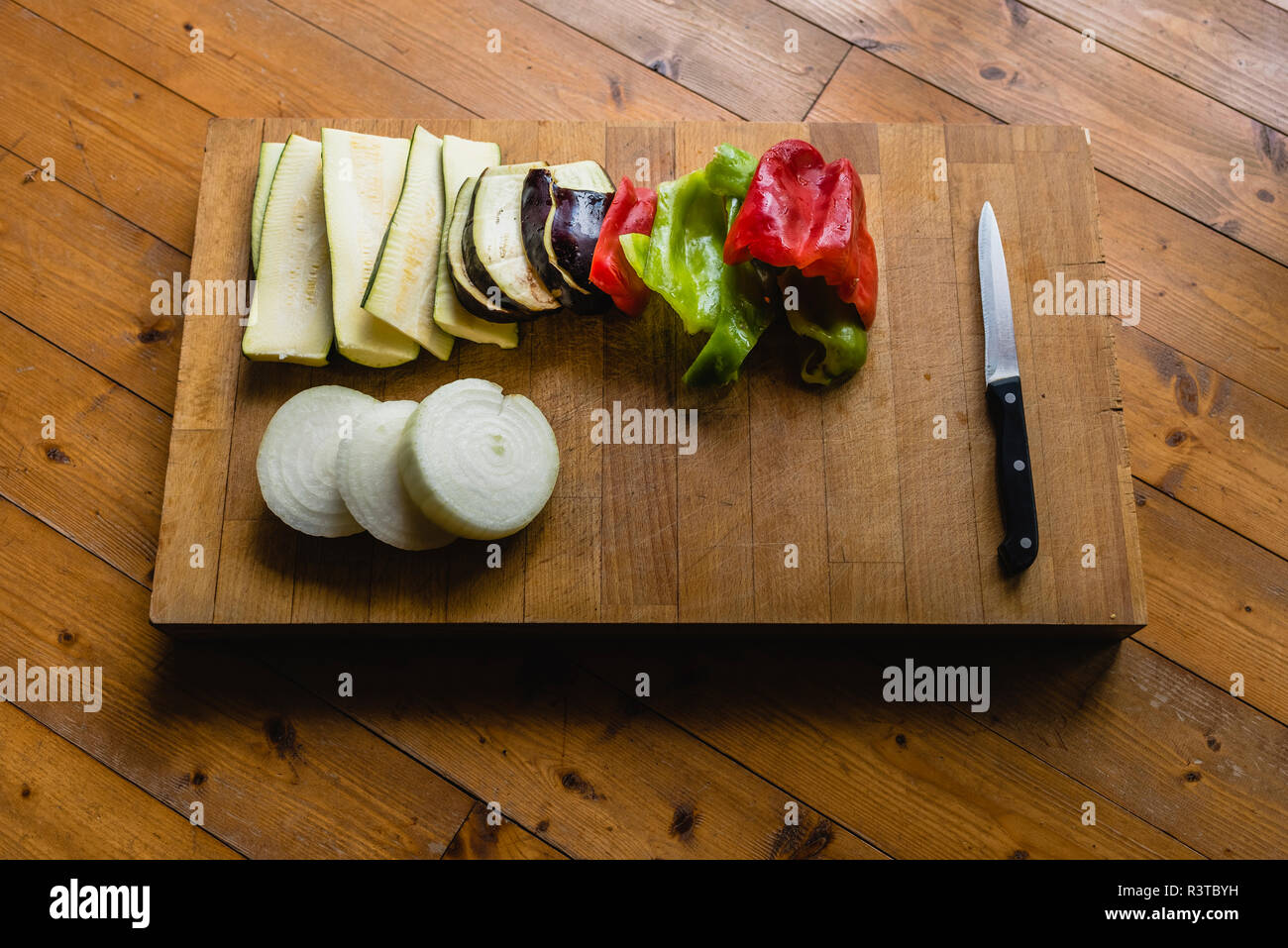 Fresh vegetables cut with knife in the kitchen Stock Photo - Alamy