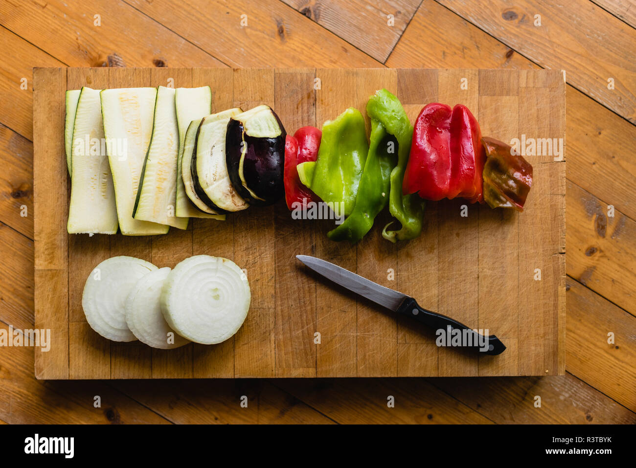 Fresh vegetables cut with knife in the kitchen Stock Photo - Alamy