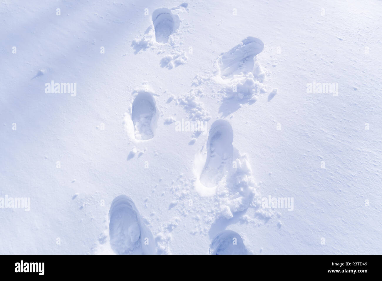 Footprint and hands on snow for texture background Stock Photo - Alamy