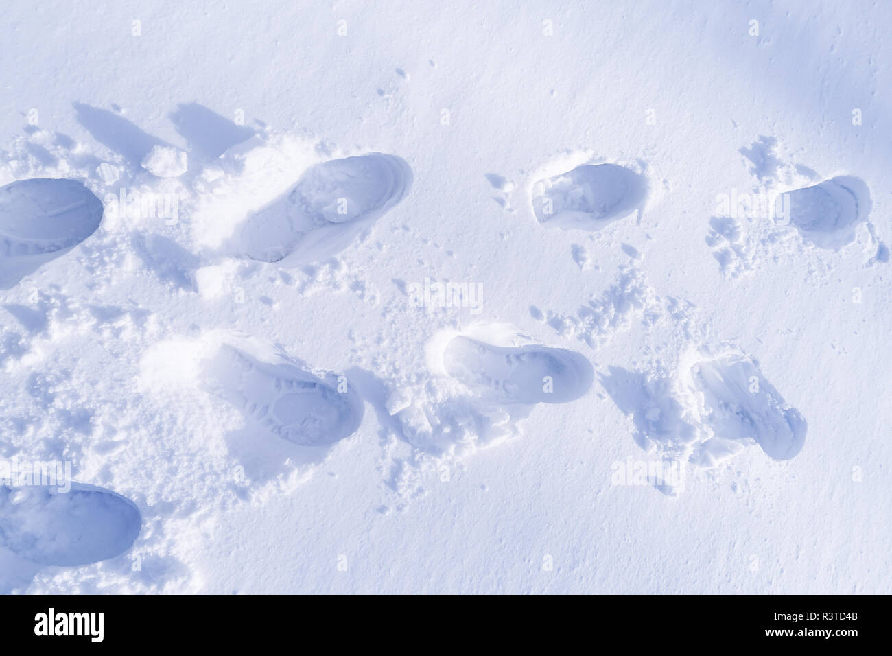 Footprint and hands on snow for texture background Stock Photo - Alamy