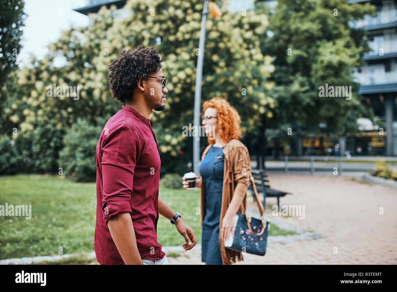 Man and woman going to work, passing each other Stock Photo - Alamy