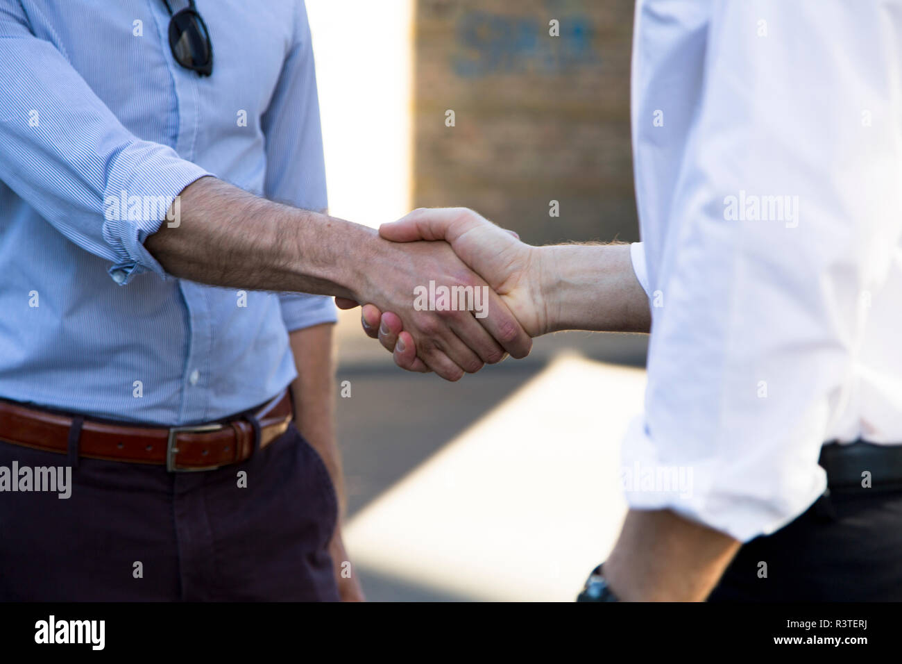 Hand shaking two adult hi-res stock photography and images - Alamy