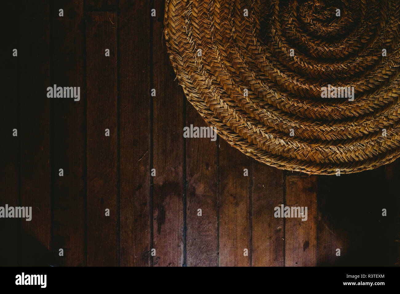 Circular wicker mat on wooden floor background, view from above Stock ...