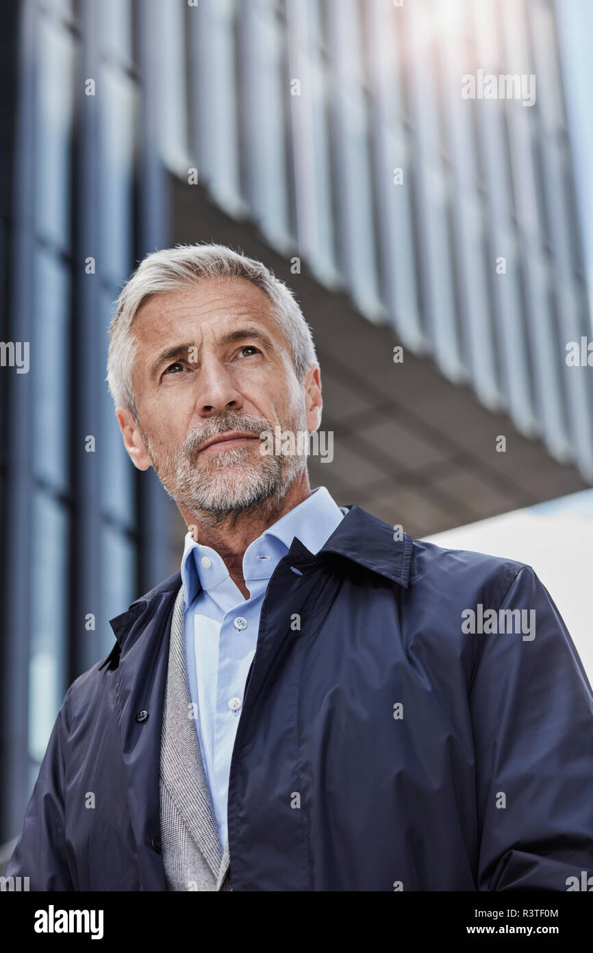 Portrait of pensive businessman outdoors Stock Photo - Alamy