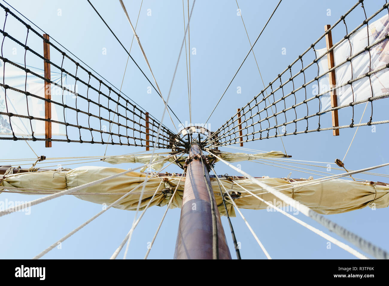 Mainmast and rope ladders to hold the sails of a sailboat Stock Photo ...