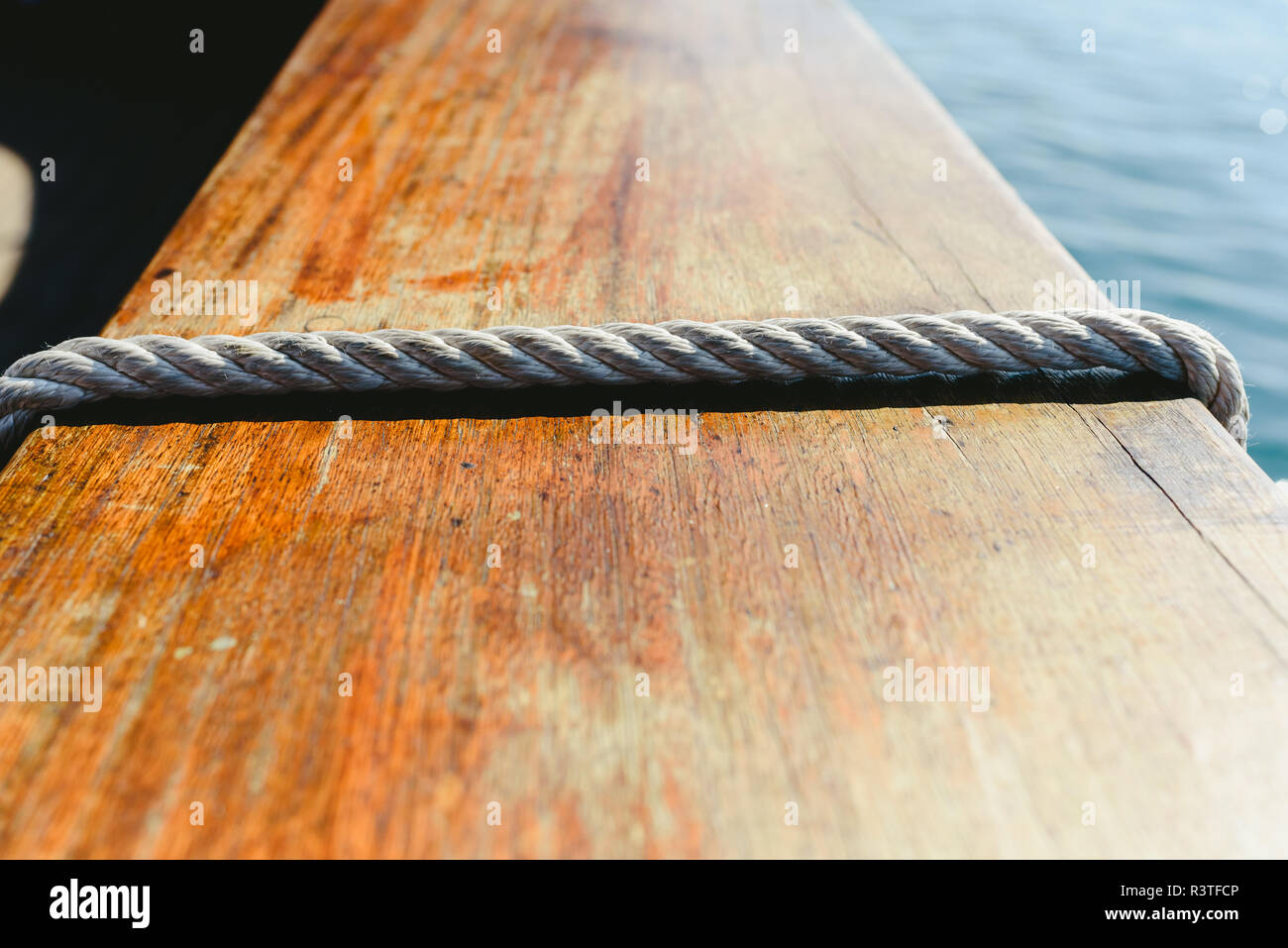 Rope holding boat railing Stock Photo - Alamy