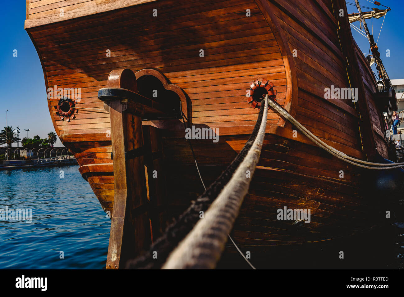 Stern of old galley docked in port to navigate the ocean in the ...