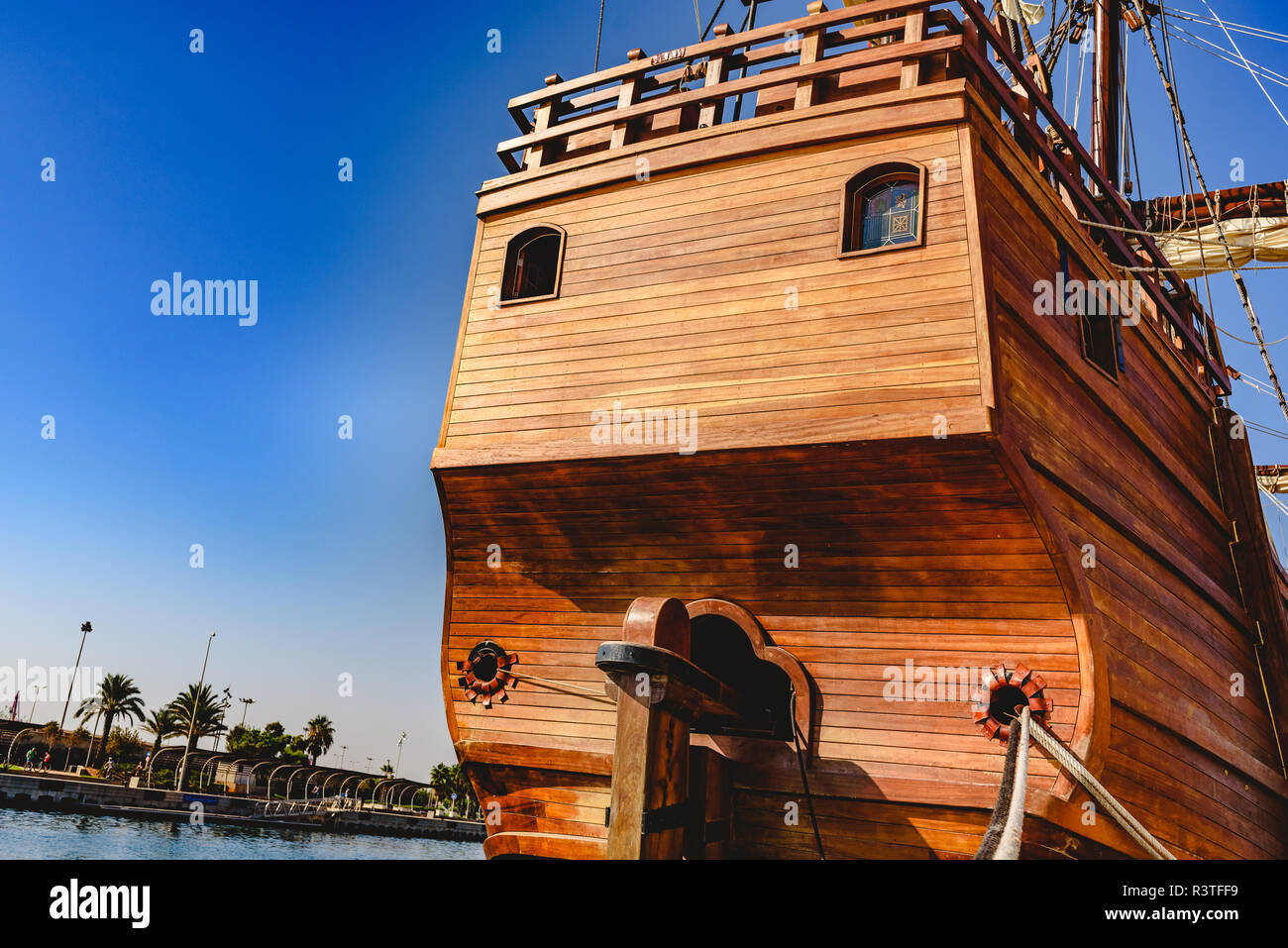 Stern of old galley docked in port to navigate the ocean in the ...