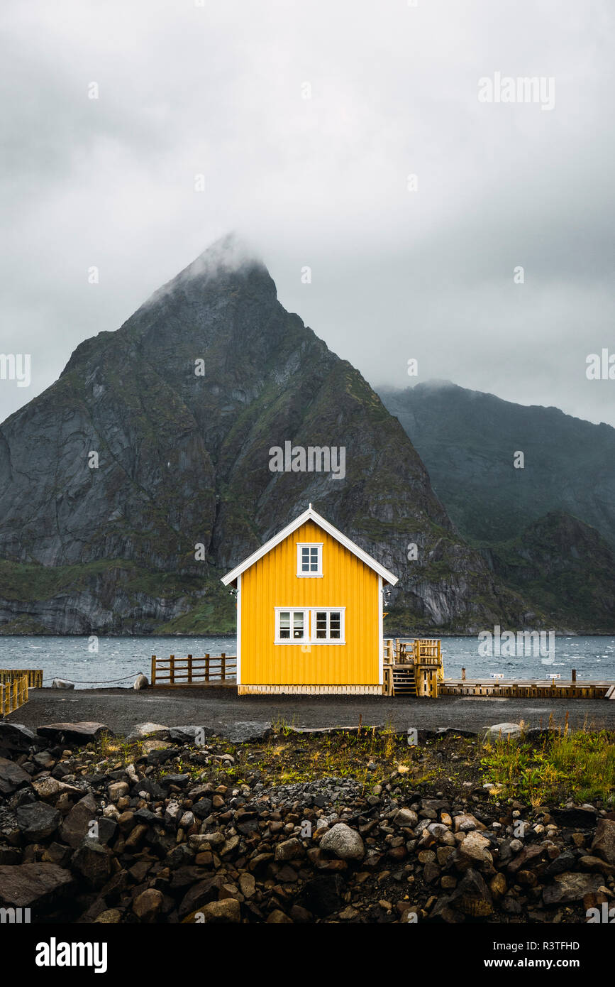 Norway, Lofoten, remote yellow house at rocky coast Stock Photo - Alamy